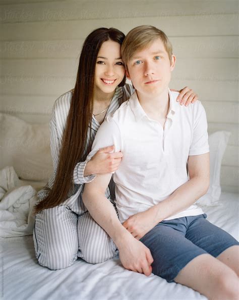 Hugging Pair Looking At Camera By Stocksy Contributor Duet Postscriptum Stocksy