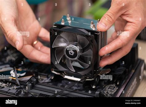 Engineer Man Installing Aluminum Heat Sink Install At Computer Circuit