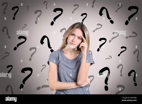 amnesia concept woman trying to remember something question marks on
