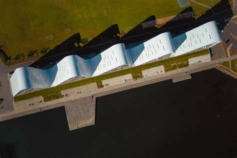 Eye Catching Wave Shaped Building Adds A Dynamic Form To This Danish Towns Skyline Yanko Design