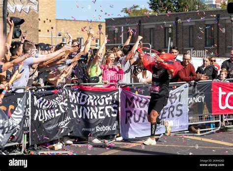 A Runner Seen Showered In Confetti At A Supporter Cheer Zone With