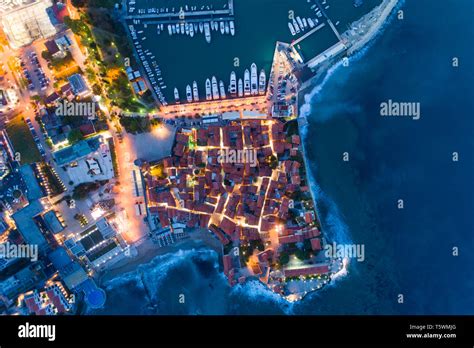 Aerial View Of The Old Town Budva At Night With Town Illuminations