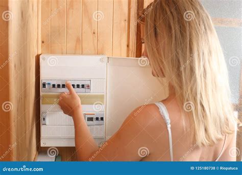 Woman Switching Fuses On A Automatic Fuse Box Stock Photo Image Of Electricity Leakage 125180738