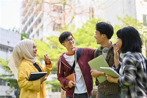 A Group Of Joyful Asian Diverse College Students Are Enjoying Talking