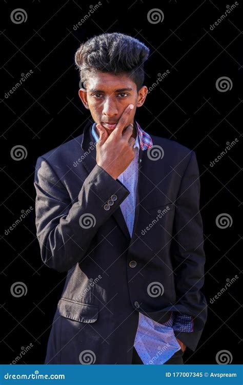 Handsome Young Man On Black Background Looking At Camera Portrait Of