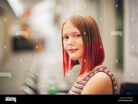 Outdoor Close Up Portrait Of Pretty Teenage Girl With Red Dyed Hair