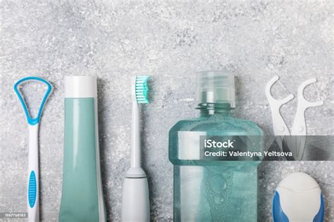 Bathroom With Sonic Electric Toothbrush Toothpaste Mouthwash Dental Floss And Tongue Cleaner