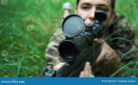 Male Sniper Looking Through The Scope Of His Sniper Rifle Stock Footage Video Of Armor
