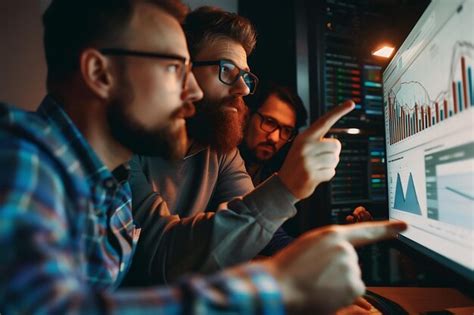 Three Colleagues Analyze Data On A Computer Screen Premium Ai Generated Image