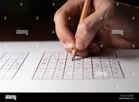 Solving Sudoku Puzzle With Pencil Stock Photo Alamy