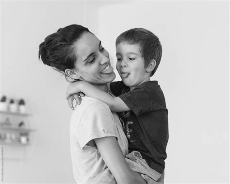 Mother And Her Son Sticking Out Their Tongues By Stocksy Contributor