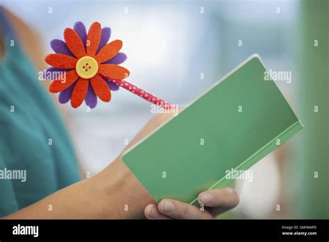 Close Up Shot Of A Woman Taking Notes In Notepad Pen With Bright