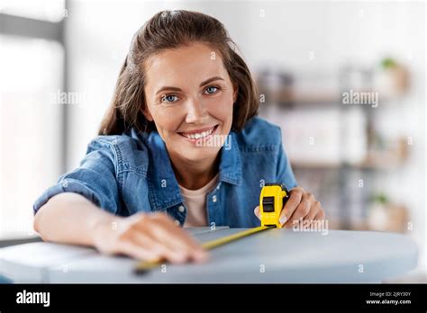 Woman With Ruler Measuring Table For Renovation Stock Photo Alamy