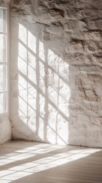 Pale Sunlight Falling Across A Rough Stone Wall Window Shadow Creating