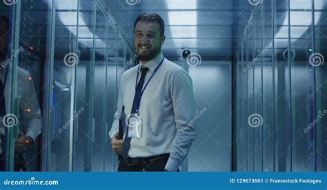 Smiling Engineer In Corridor Of Data Center Stock Image Image Of