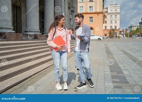 Happy Students Leaving The University Building Concept Of Education