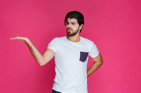 Free Photo Man Pointing To Someone Or Something In The Left