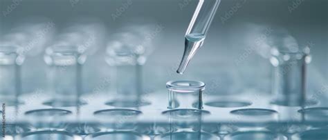 A Precision Pipette Dispensing Exact Volumes Of Liquid Into Test Tubes Indispensable For