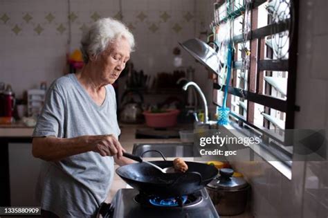 Old Lady Stove Photos And Premium High Res Pictures Getty Images