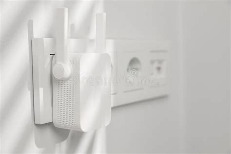 Wireless Wi Fi Repeater On White Wall Indoors Space For Text Stock Photo Image Of Digital