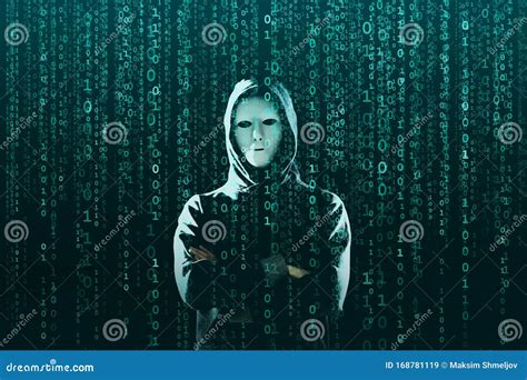 Computer Hacker In Mask And Hoodie Over Abstract Binary Background Obscured Dark Face Stock