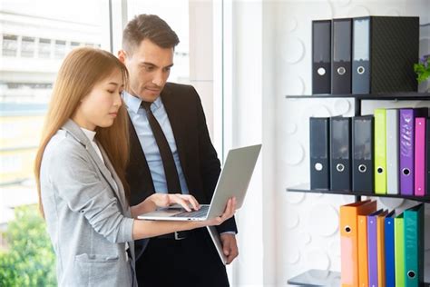 Premium Photo Smart Boss And Secretary Working Together With Laptop
