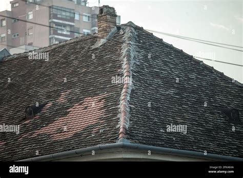 Picture Of An Old Roof Partially Repaired But Mainly In Poor