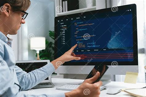 It Developer Pointing On Coding Software On Pc Comparing Laptop