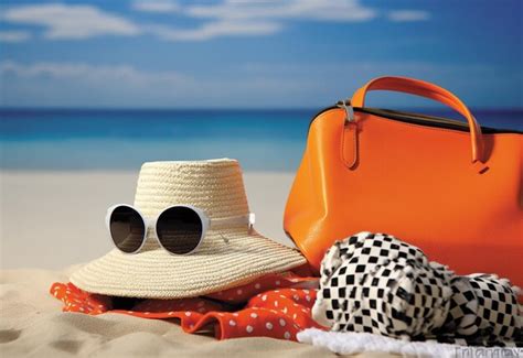 Premium Ai Image A Beach Scene With A Hat Sunglasses And Straw Hat