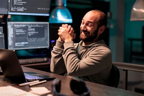 premium photo app developer feeling happy about coding victory