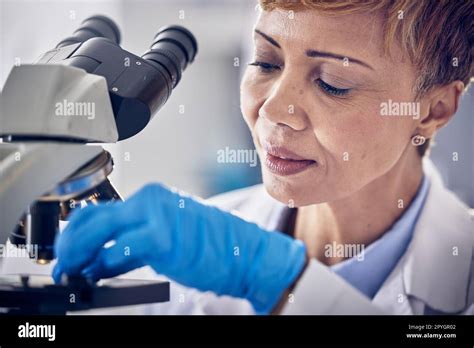 Science Laboratory And Black Woman With Microscope Research For Vaccine Development