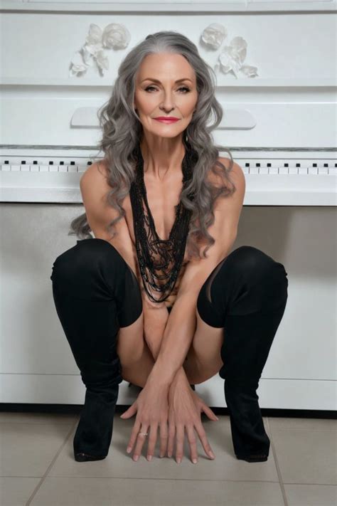 An Older Woman Sitting On The Floor In Front Of A Piano