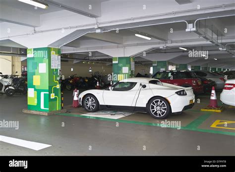 Dh Electric Charging Point TRANSPORT ASIA China Tesla Roadster Car In Hong Kong Carpark Charging