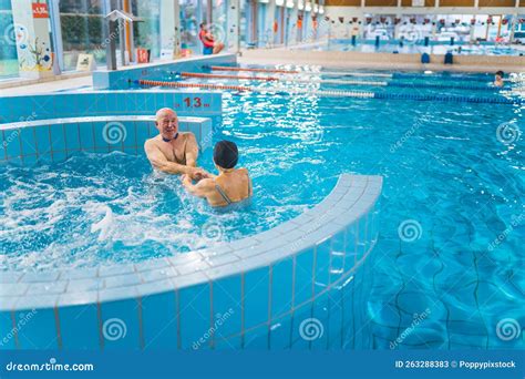 Types Of Pools At A Swimming Pool Area Two Happy Senior Adults Playing In A Jacuzzi And Lazy