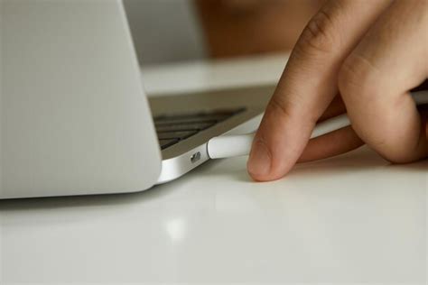 Premium Photo Connecting Cable To Laptop Closeup