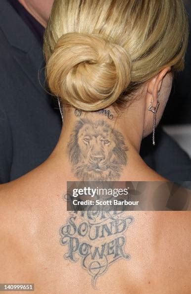 A Tattoo Is Seen On The Back Of Mena Suvari As She Arrives At The