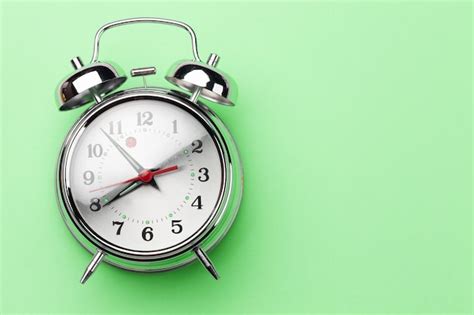 Premium Photo Freen Workplace Desk Table With Alarm Clock