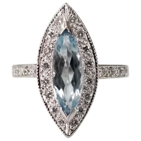 14 Karat White Gold Blue Topaz Marquise Cut And Diamond Ring For Sale