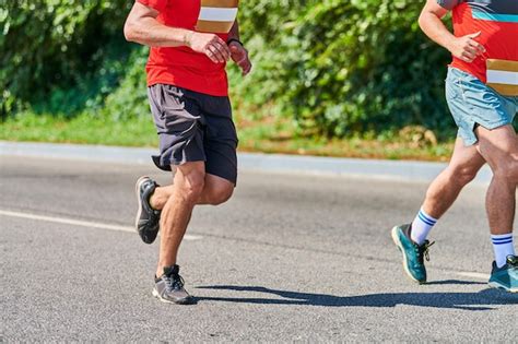 Premium Photo Rear View Of Man Running On Road
