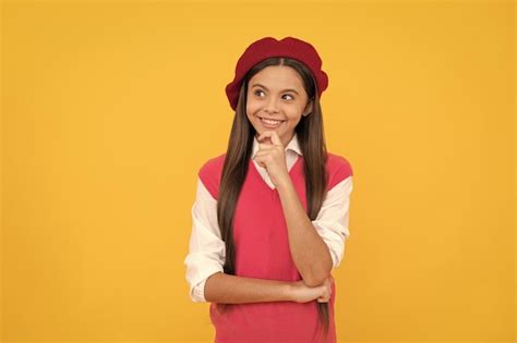 Premium Photo Thoughtful Teen School Girl In French Beret On Yellow