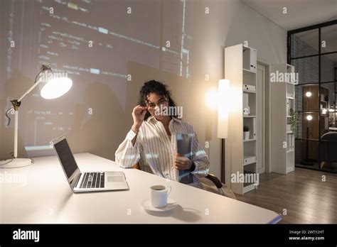 Female African American Programmer Working With Clipboard In Office At