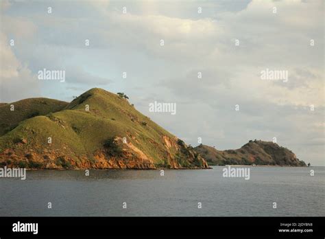 Landscape Of A Hill Covered With Grassland Is Seen From A Boat That Is