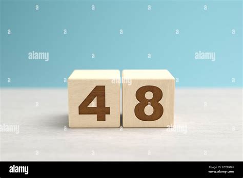 Wooden toy blocks forming the number 48 Stock Photo - Alamy