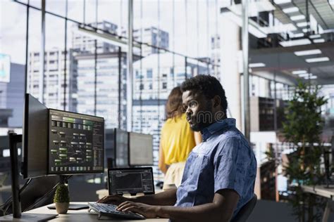 Programmer Developing And Maintaining Machine Learning Apis Stock Image