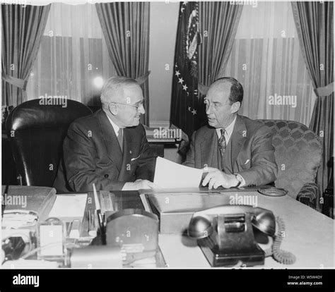 Photograph Of President Truman At His Desk In The Oval Office With