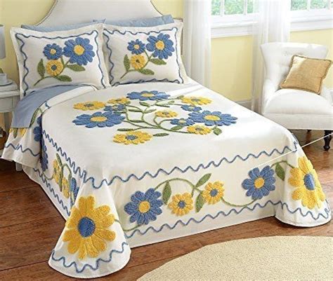 White Bed With Blue And Yellow Floral Bedspread