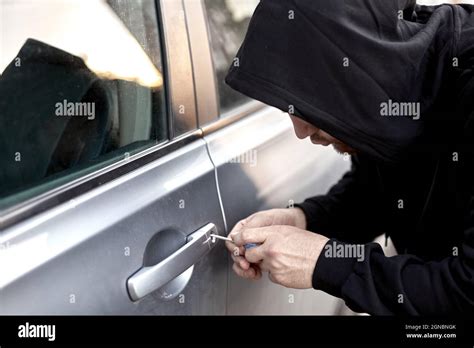 Unrecognizable Car Thief Steal Car Breaking Door Criminal Job Burglar Hijacks Auto Thief Is