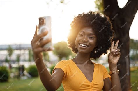 Premium Photo Portrait Of A Young Afro American Woman Taking A Selfie