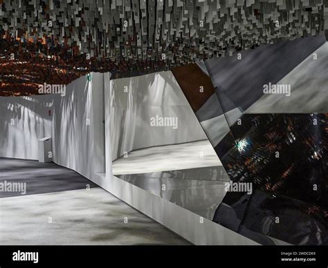 Futuristic Interior With Geometric Shapes And Reflective Metallic Surfaces Interior Design