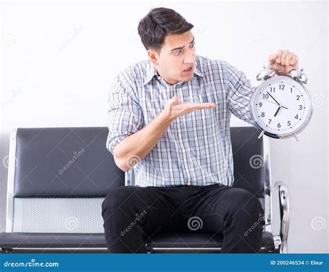 Man Nervously Impatiently Waiting In The Lobby Stock Photo Image Of Home Clock